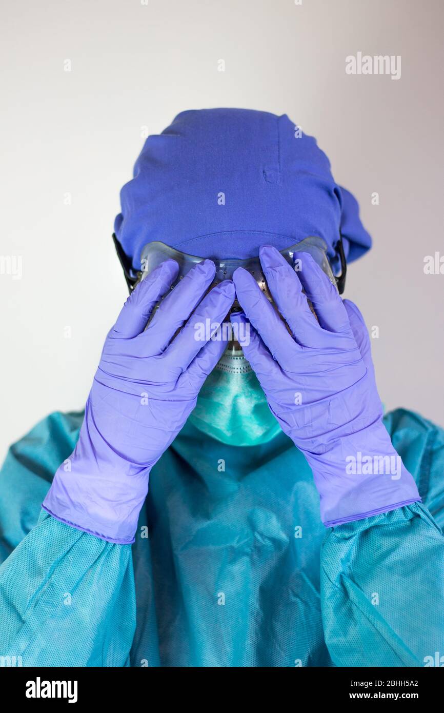 Nurse glasses mask cap gloves gown hi-res stock photography and images ...