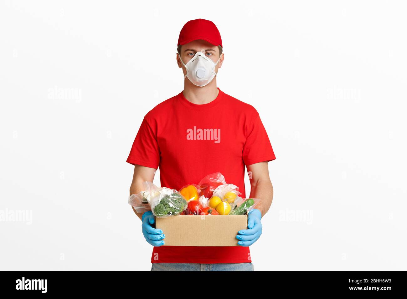 Food delivery concept. Courier in protective mask Stock Photo - Alamy