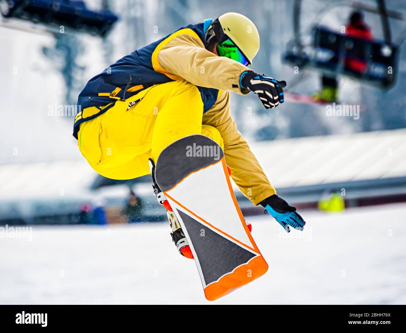 Snowboarder during a trick on a slope Stock Photo - Alamy