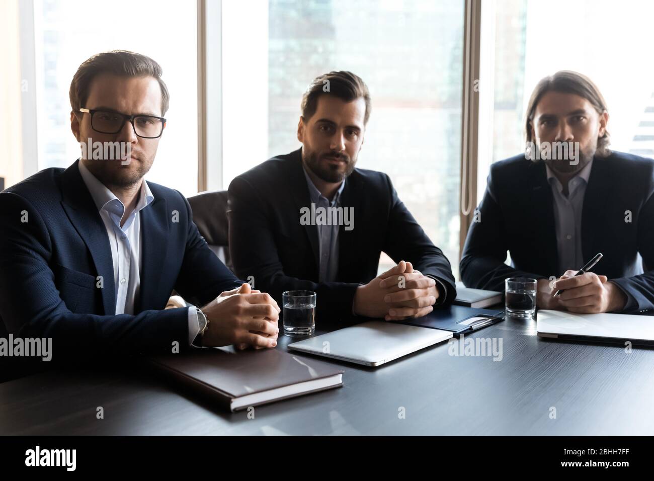 Portrait confident businessman table hi-res stock photography and ...