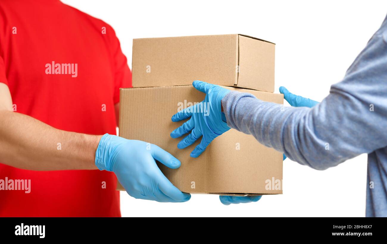 Fast home delivery. Courier gives parcels isolated on white background ...