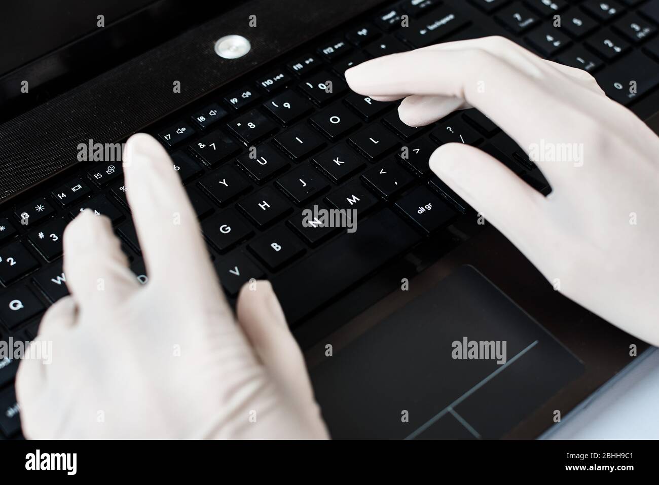 Computer keyboard hands gloves typing hi-res stock photography and ...