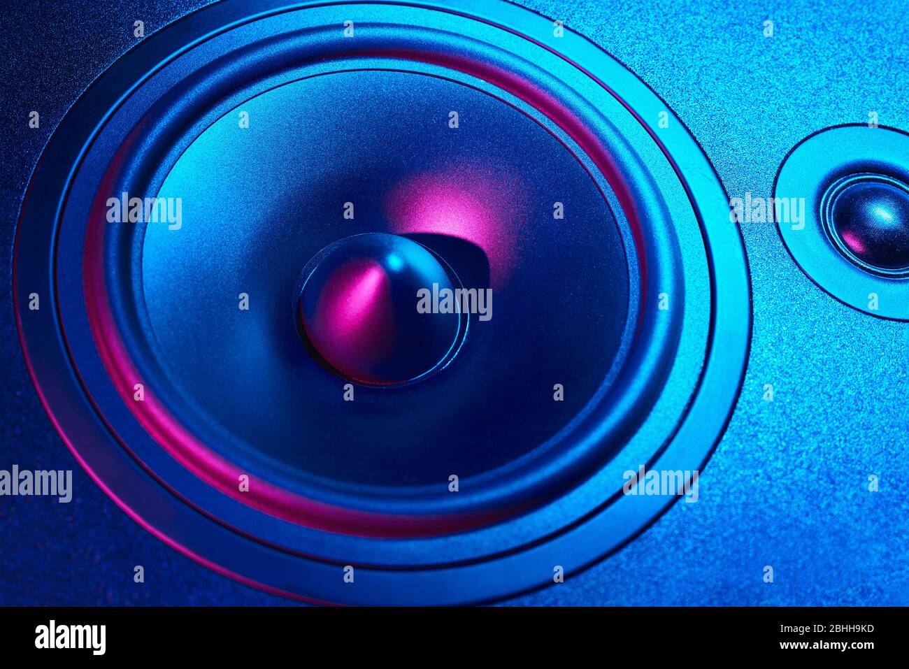 Sound audio speaker with neon lights on dark background. Dynamic ...