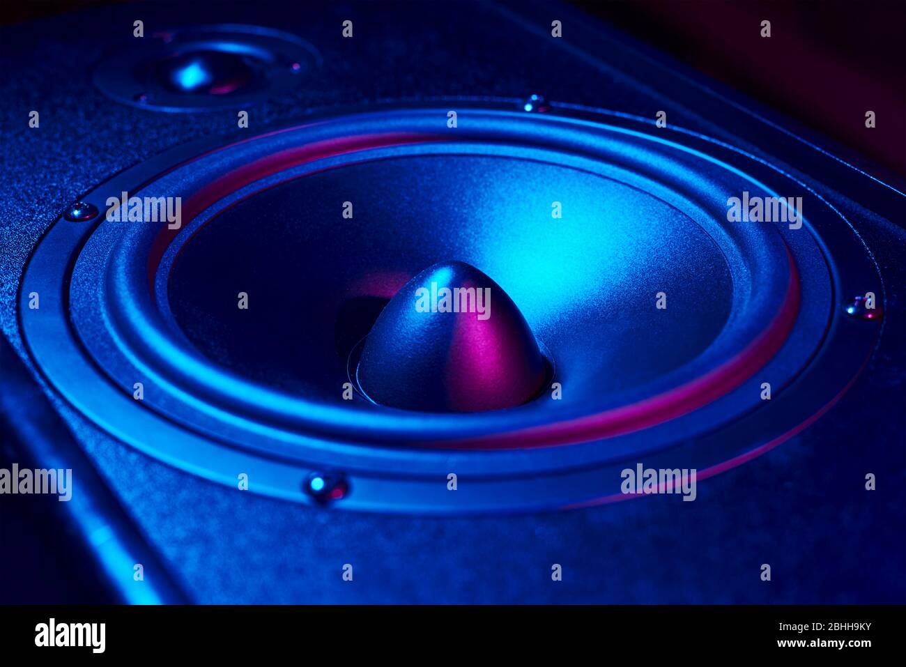 Sound audio speaker with neon lights on dark background. Dynamic ...