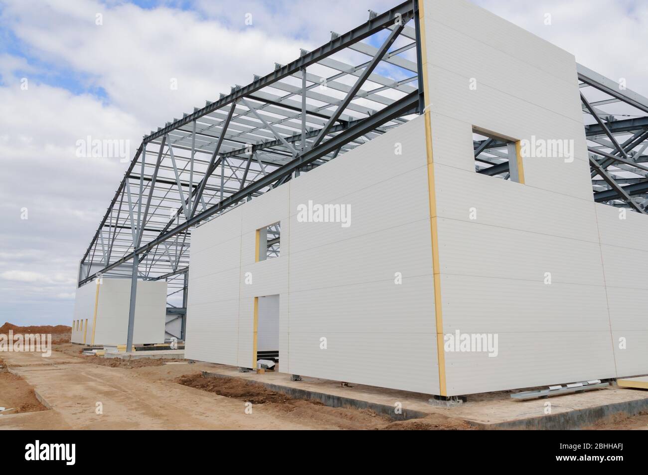 Metal frame of the building with a sandwich panel of insulation on the ...