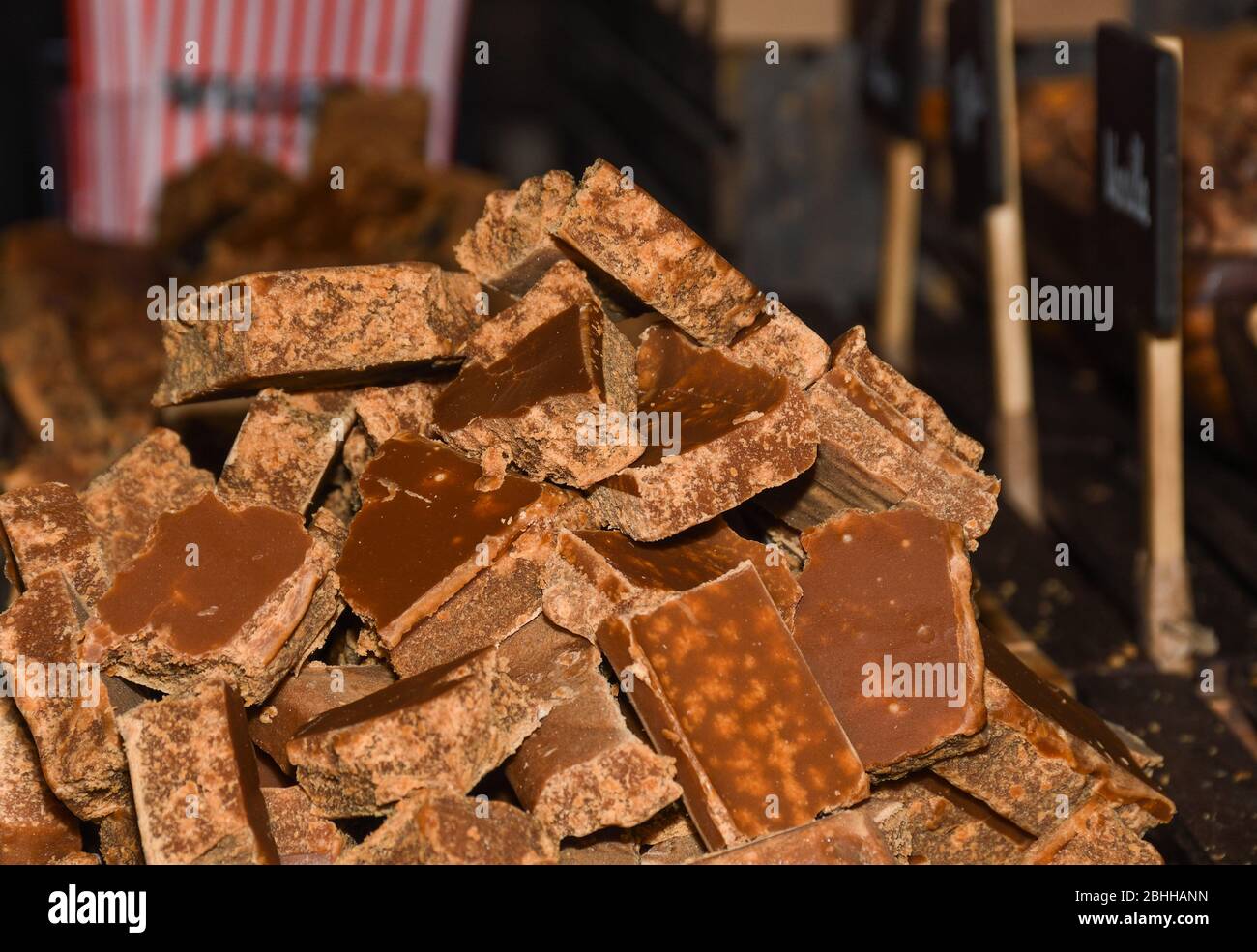 A stack of homemade caramel. Groups of caramel candy, isolated on the ...