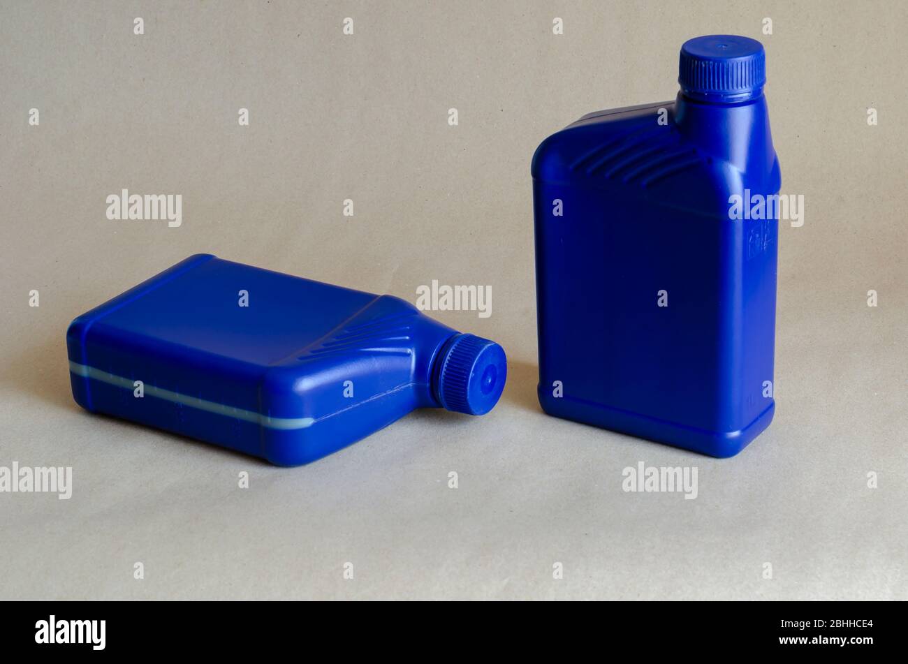 Two blue plastic canister for lubricants without label, container for ...