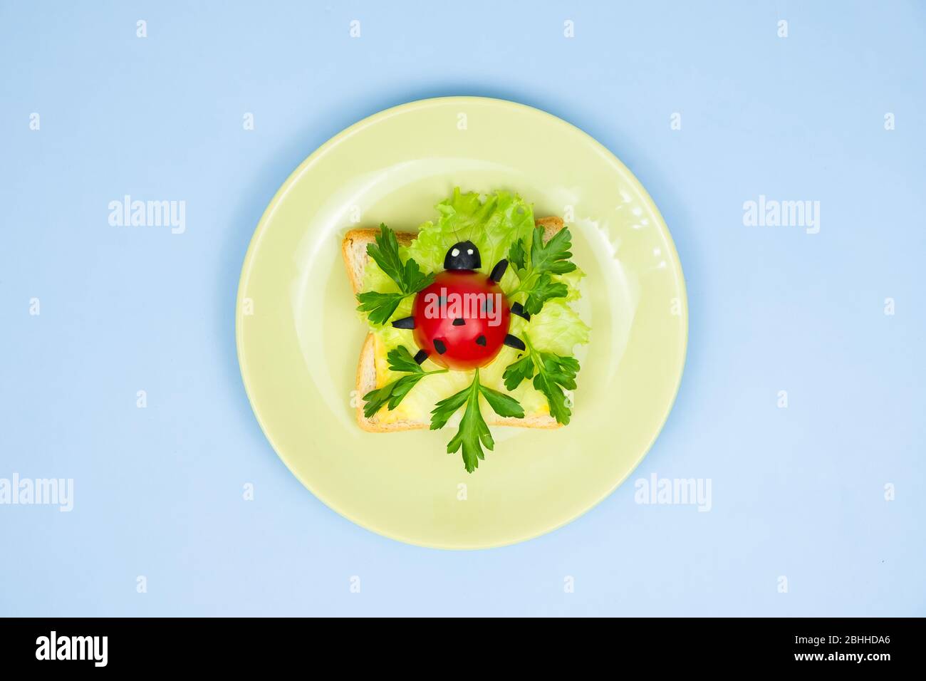 Fun food art for kids. Ladybug sandwich on blue background. How to make ...