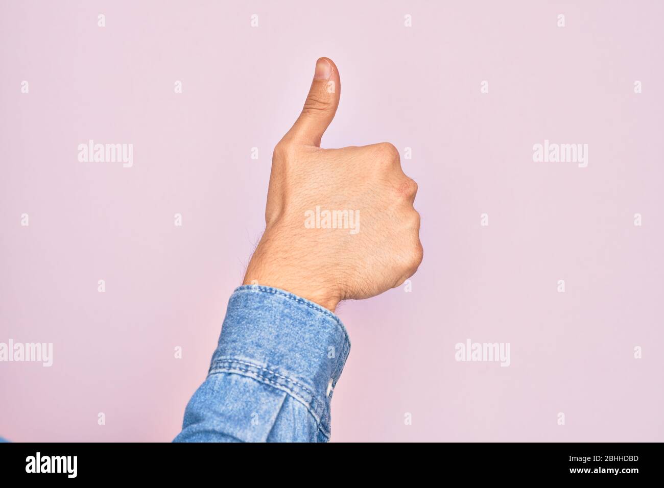 Hand of caucasian young man showing fingers over isolated pink ...