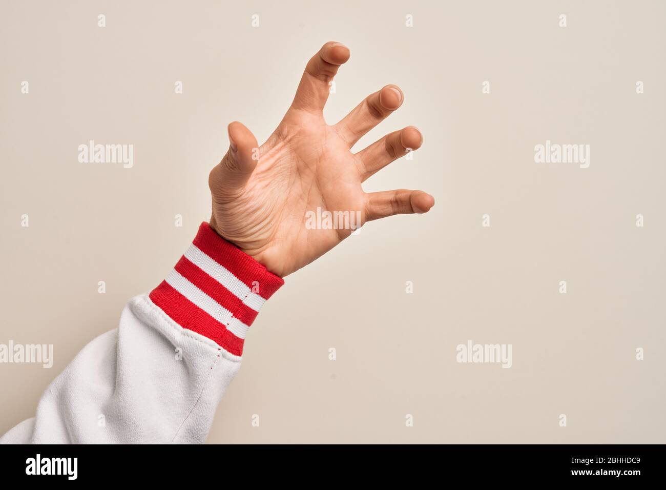 Hand of caucasian young man showing fingers over isolated white ...