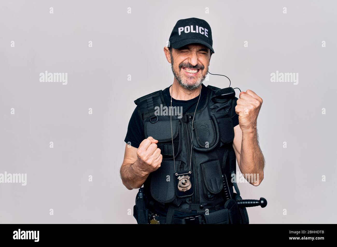 Middle age policeman wearing police uniform and bulletproof vest over ...