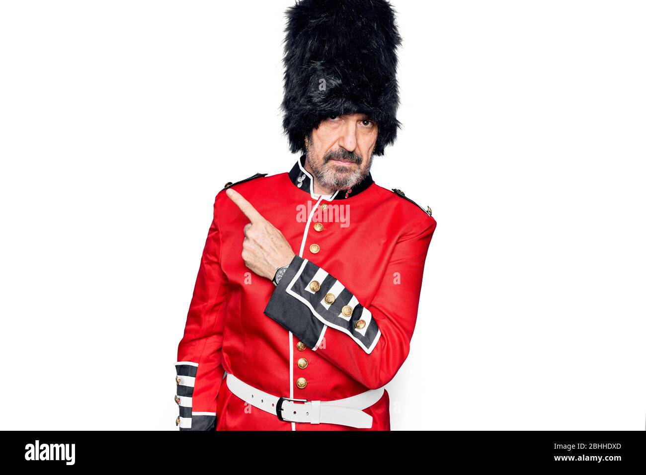 Middle age handsome wales guard man wearing traditional uniform over ...