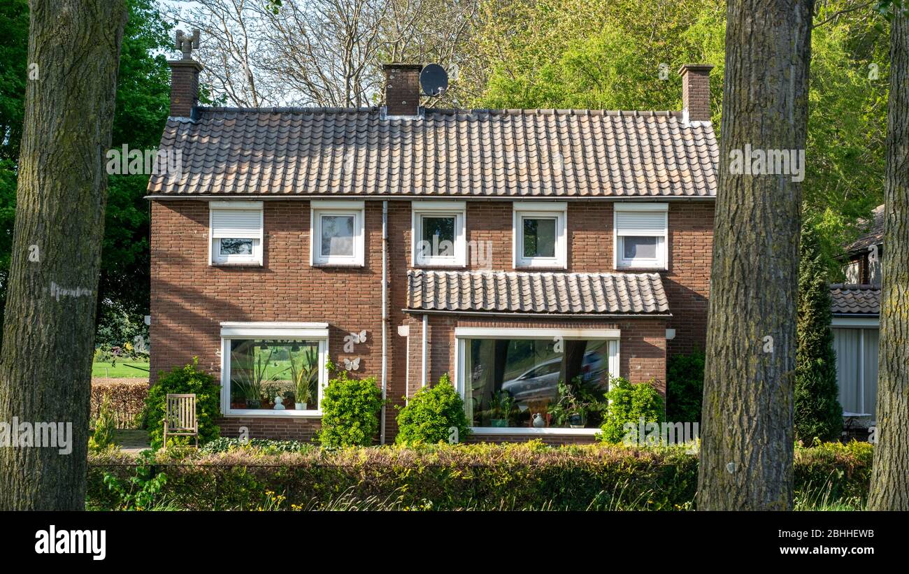 A Typical old Dutch house standing in a Dutch polder landscape next to ...