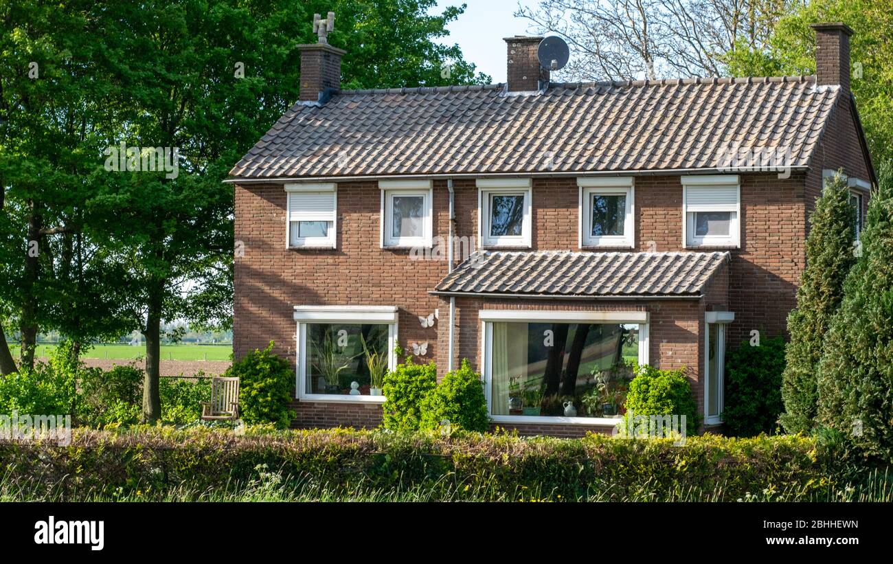 A Typical old Dutch house standing in a Dutch polder landscape next to ...