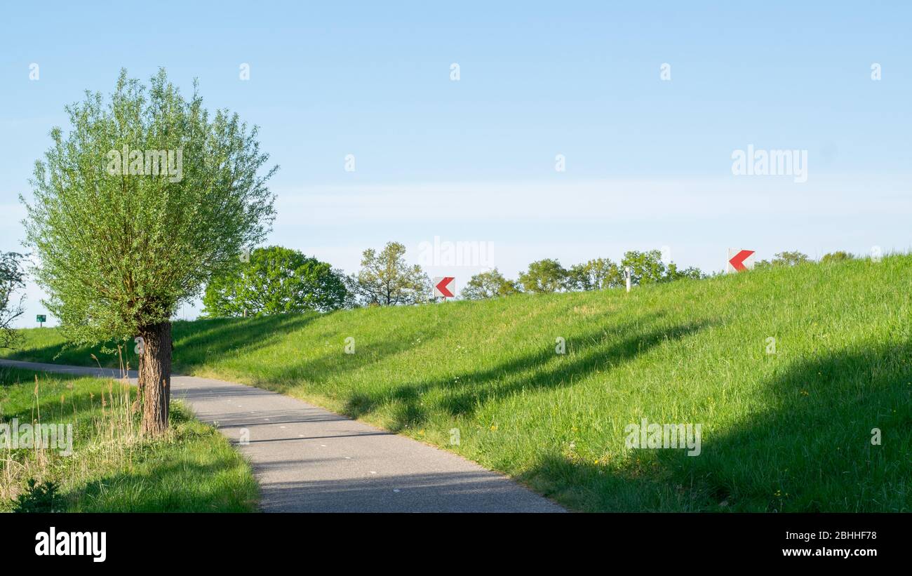 Country road with cycle path next to it hi-res stock photography and ...