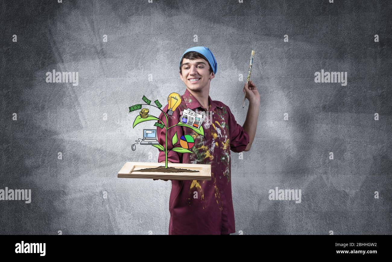 Young artist drawing plant of wealth Stock Photo - Alamy