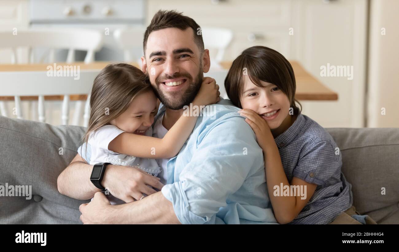 Brother sister cuddling hi-res stock photography and images - Alamy