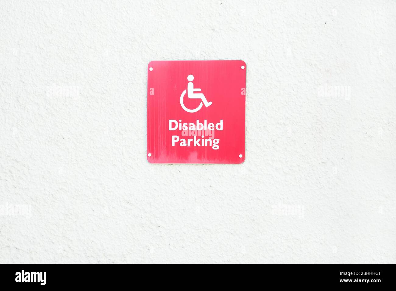 Red disabled sign on blank white wall Stock Photo - Alamy