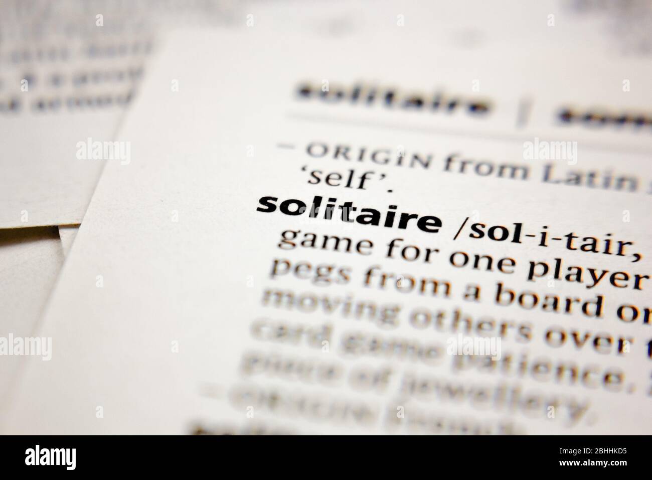 Word or phrase solitaire in a dictionary Stock Photo - Alamy