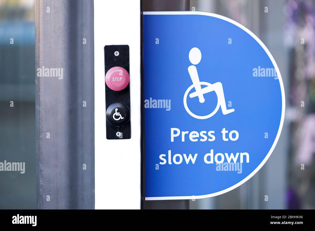 Disabled accessible push button sign at shop entrance Stock Photo - Alamy
