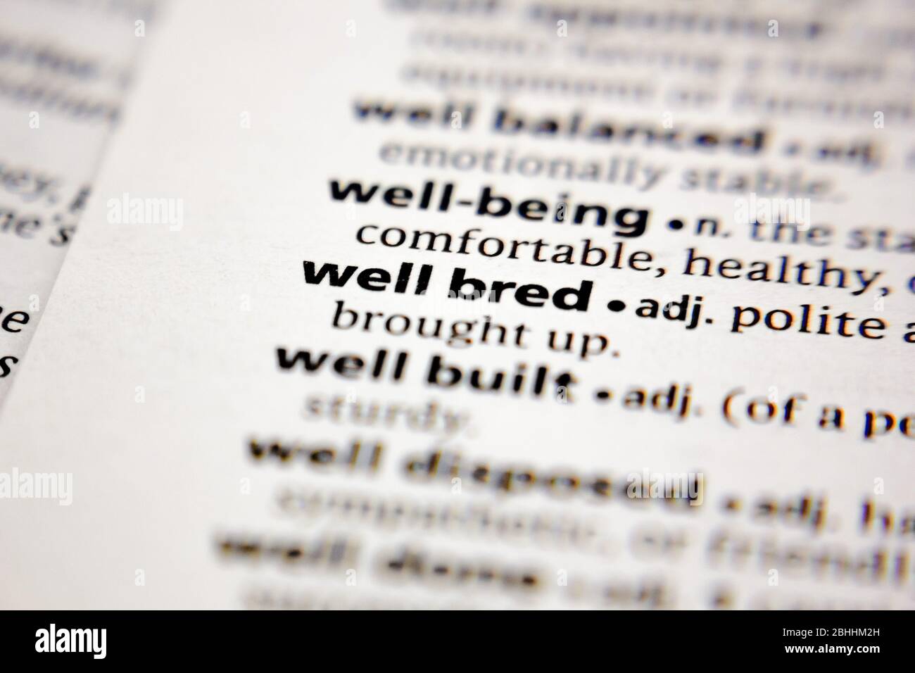Word or phrase well bred in a dictionary Stock Photo - Alamy