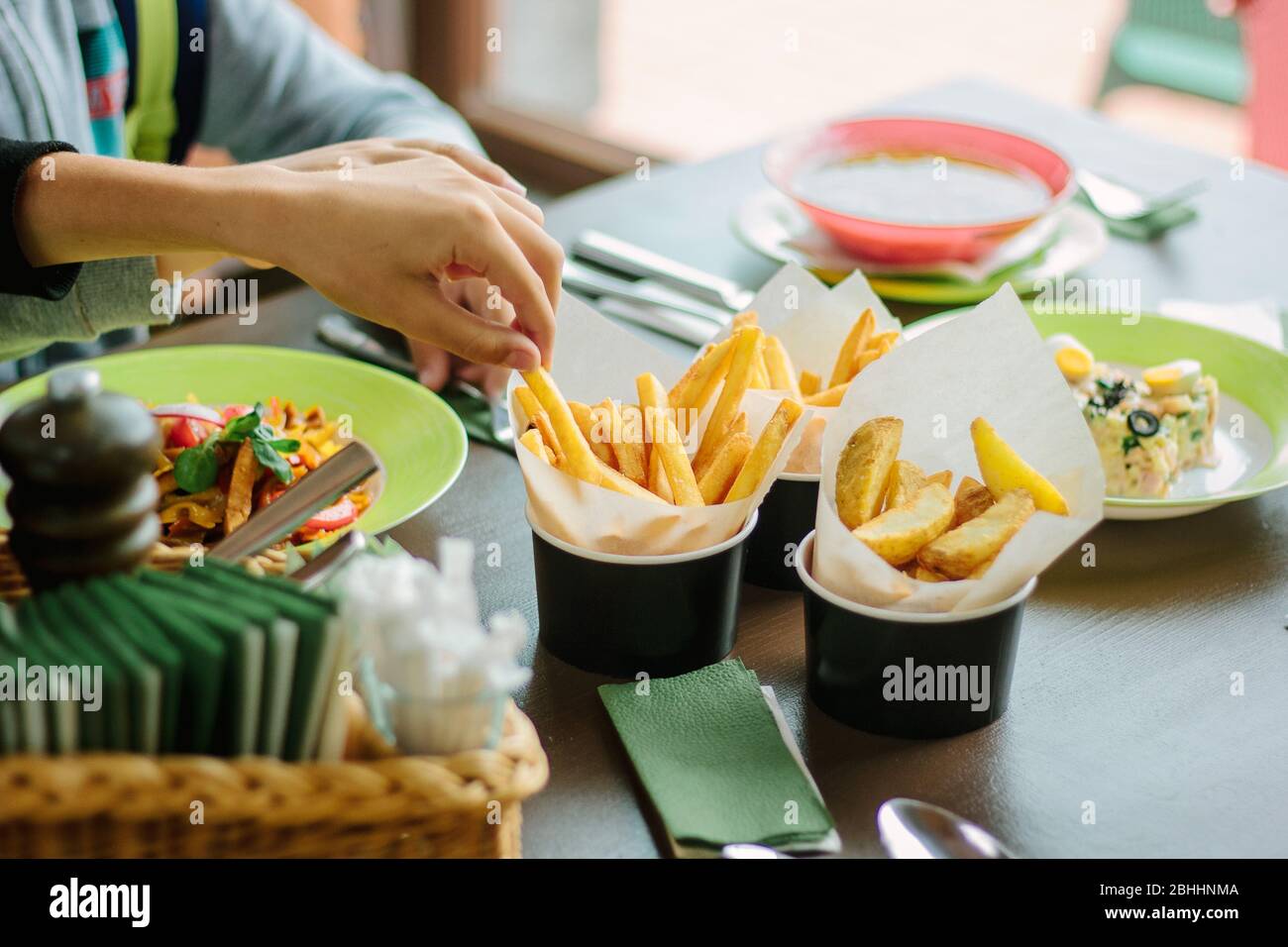 Kid hand french fries hi-res stock photography and images - Alamy