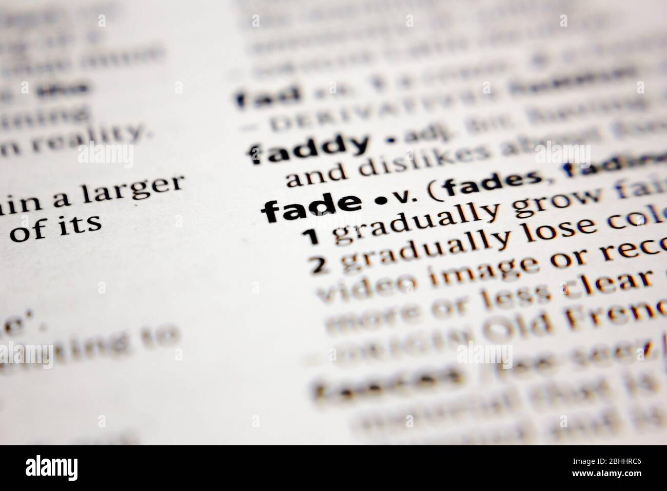 Word or phrase fade in a dictionary Stock Photo - Alamy