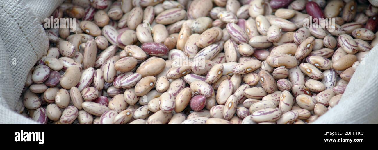 lots of beans in a jute sack for sale at the fruit and vegetable market ...