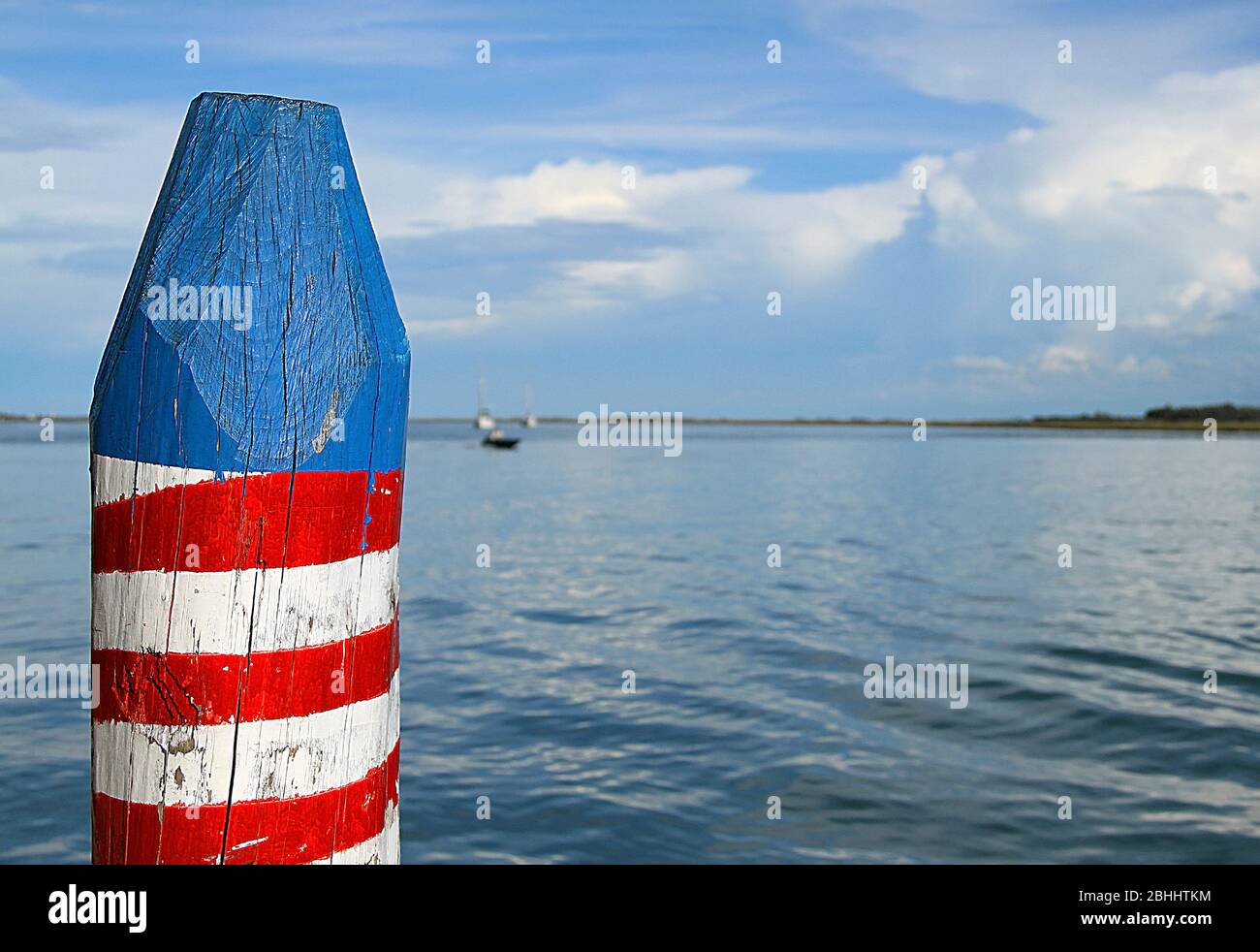 pole for mooring boats in the Venice lagoon called BRICOLA in the ...