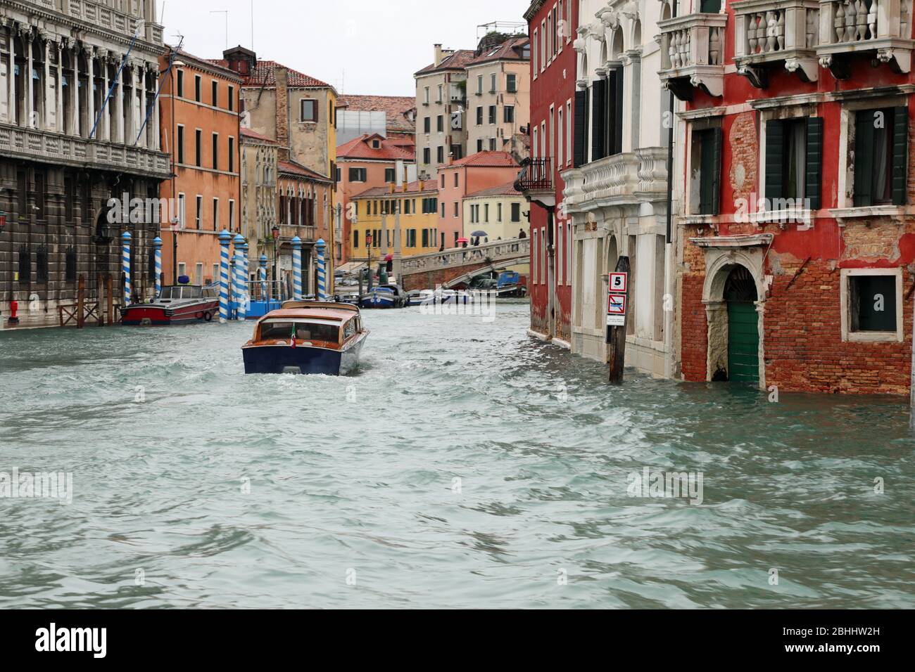 boat crosses the Grand Canal in Venice between ancient buildings Stock ...