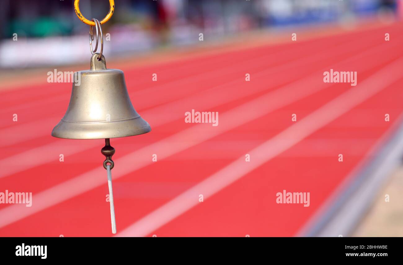 metal bell to signal the last lap of the race in the athletics stadium ...