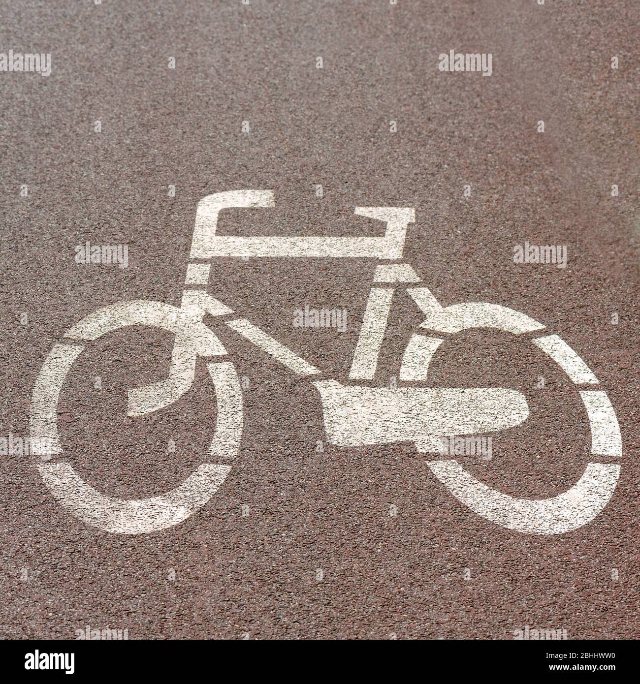 Bicycle path symbol painted on red surfaces Stock Photo - Alamy