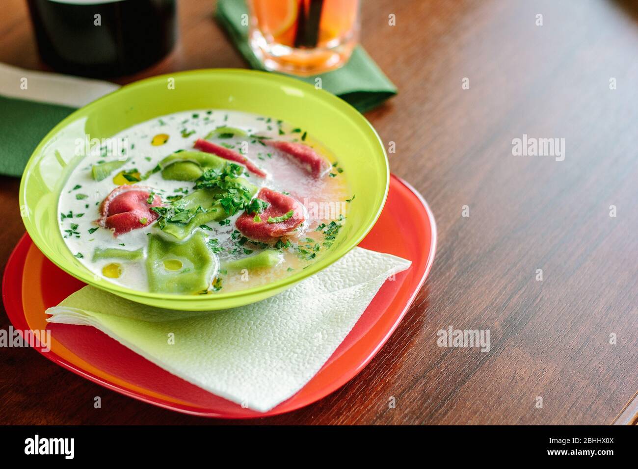 Green and red ravioli in soup for kids, great image for your needs ...