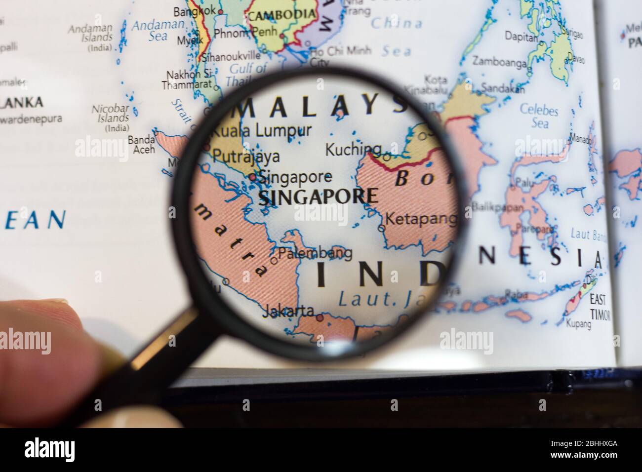 Singapore on the map of the world or atlas Stock Photo - Alamy