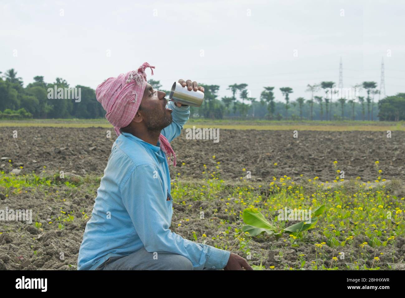 farmer drinking water during work at field Stock Photo - Alamy
