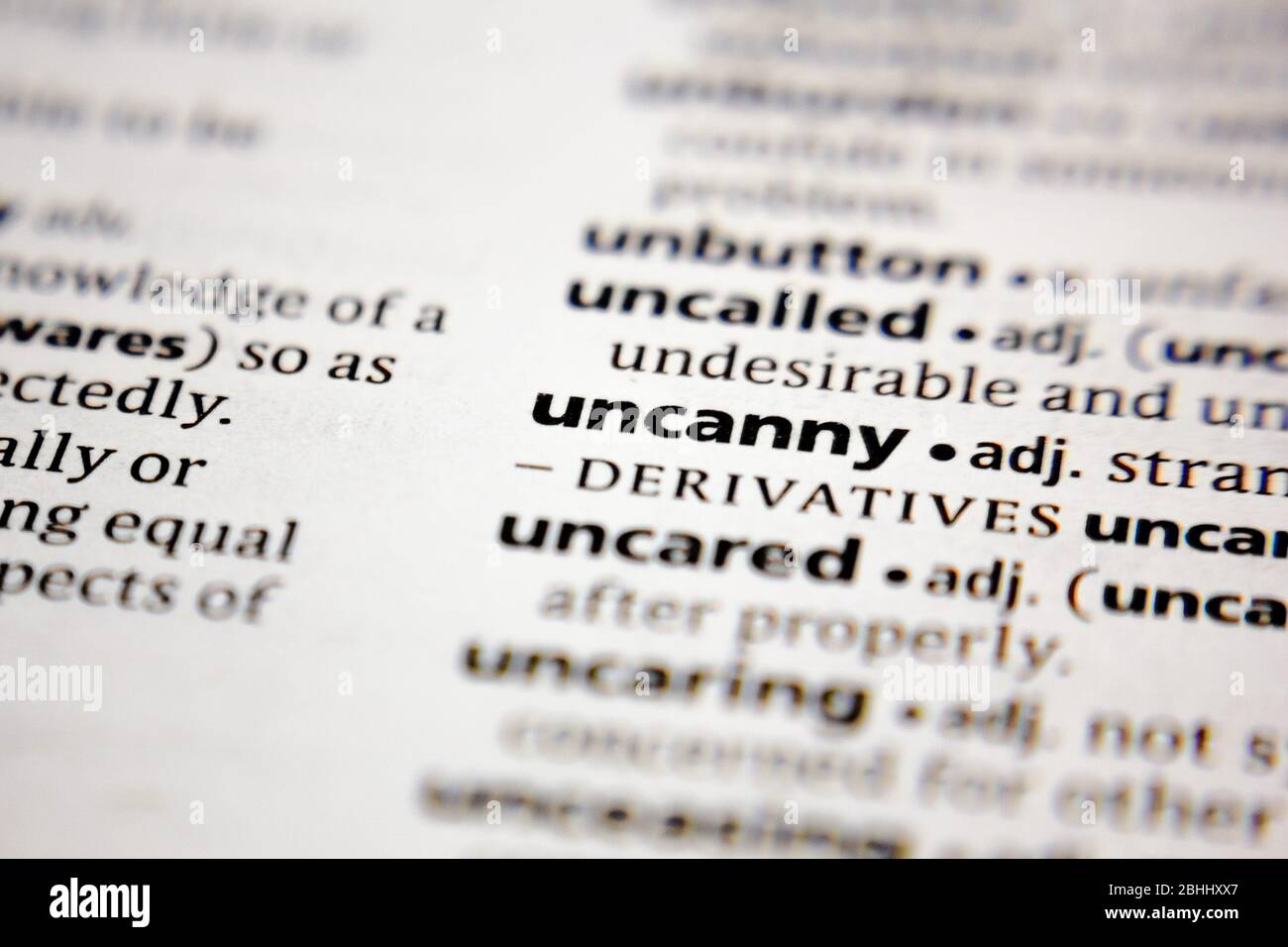 Word or phrase uncanny in a dictionary Stock Photo - Alamy