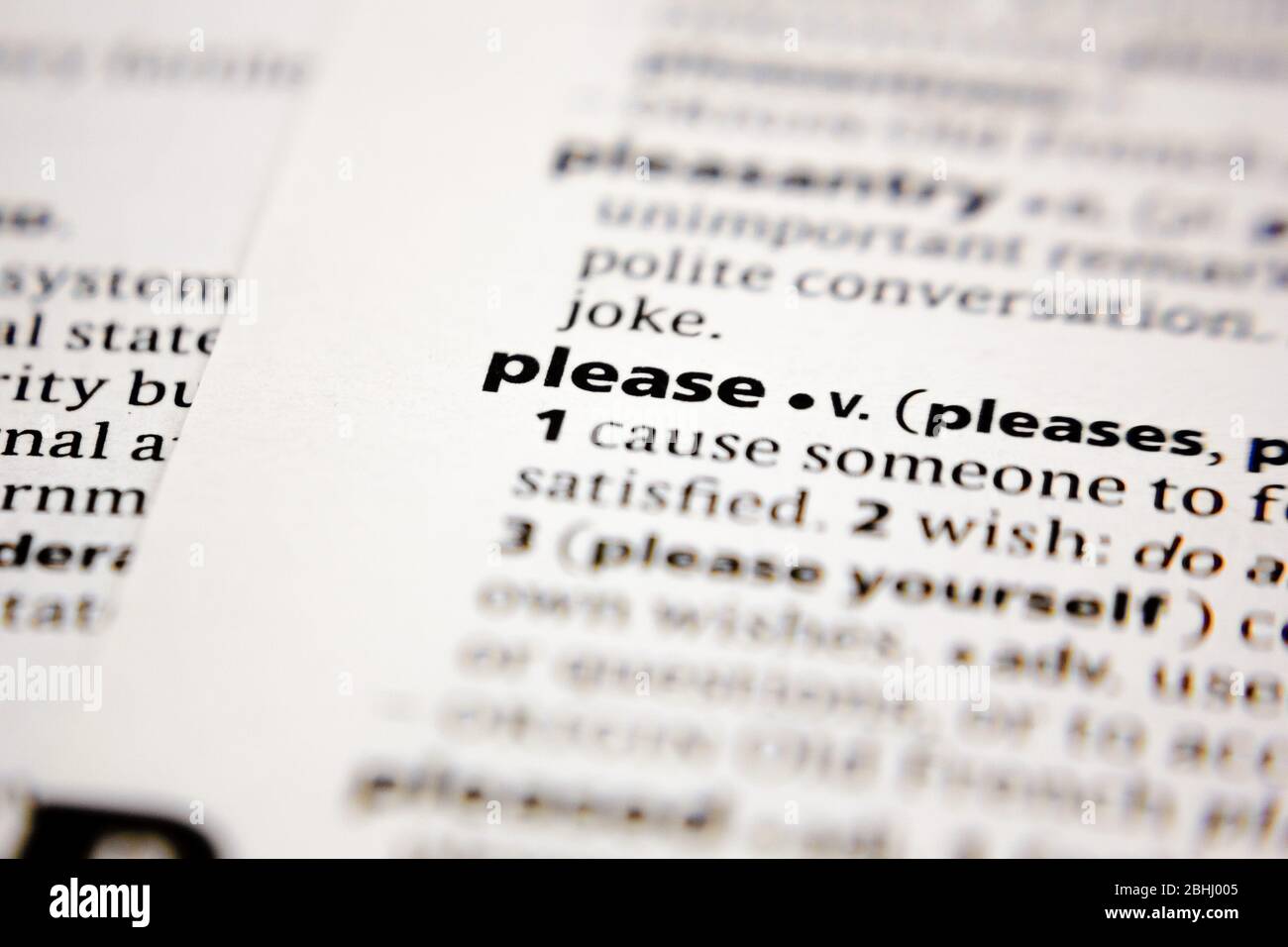 Word or phrase please in a dictionary Stock Photo - Alamy