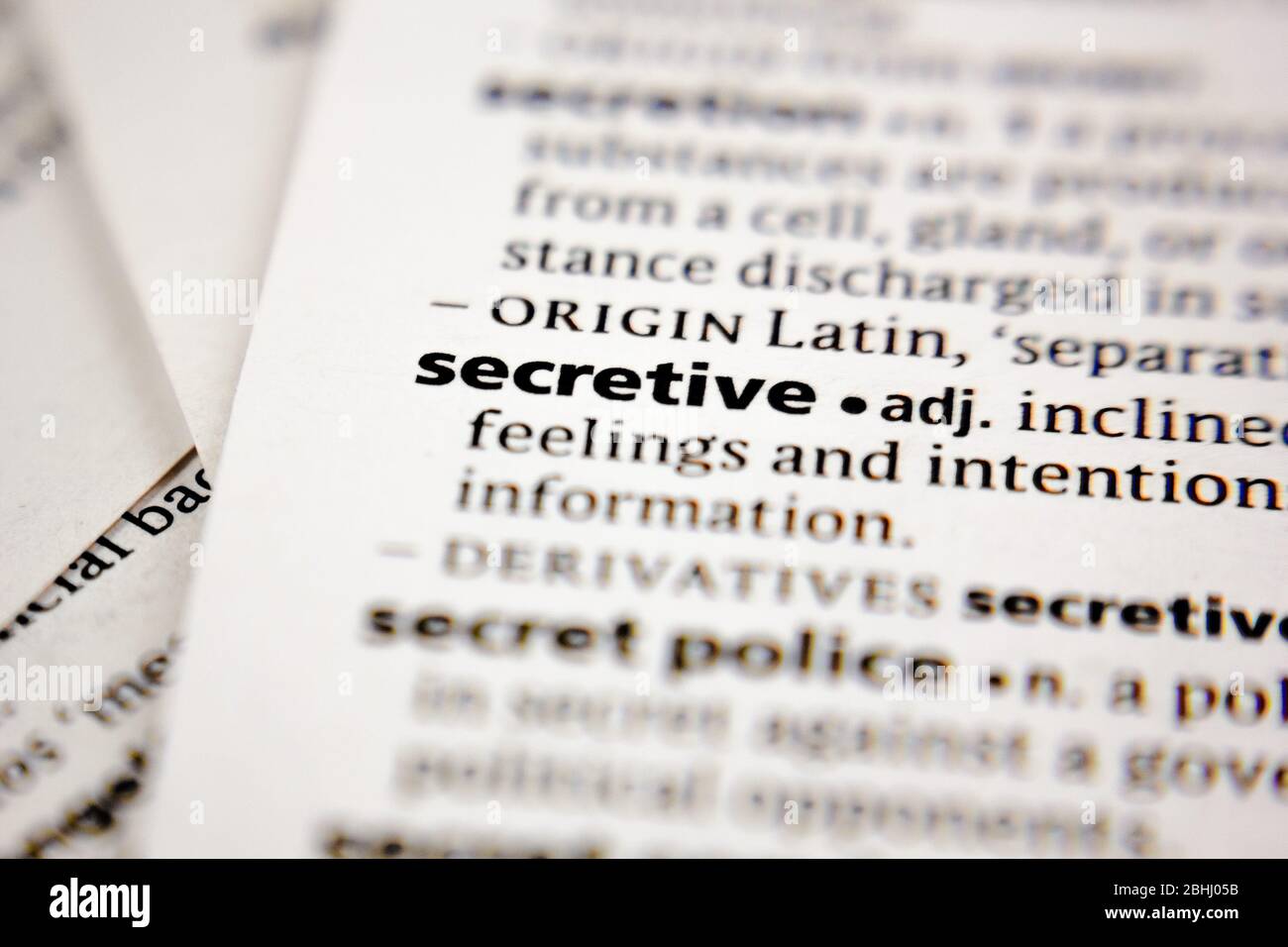 Word or phrase secretive in a dictionary Stock Photo - Alamy