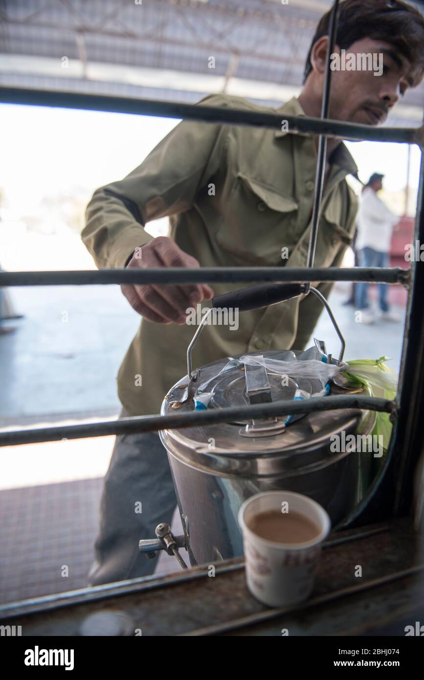 Mahoba / India 26 February 2017 Indian railway vendor selling tea to ...