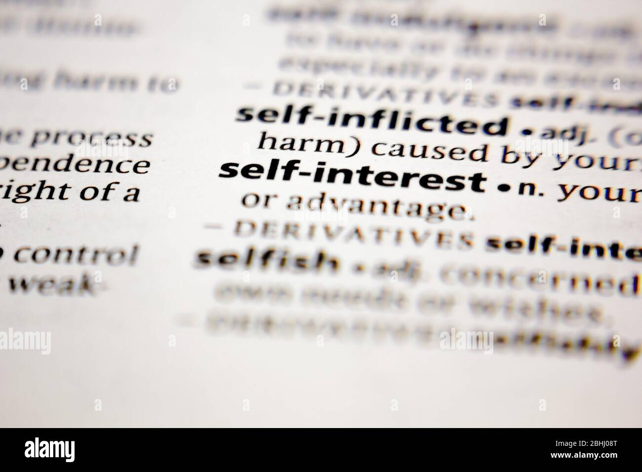 Word or phrase self-interest in a dictionary Stock Photo - Alamy
