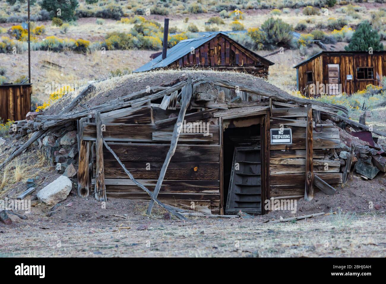 Wood shack with sod roof in the old silver and cinnabar mining ghost ...
