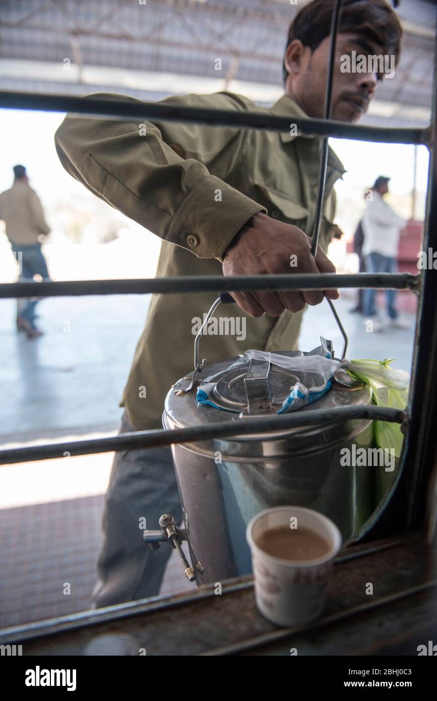 Mahoba / India 26 February 2017 Indian railway vendor selling tea to ...