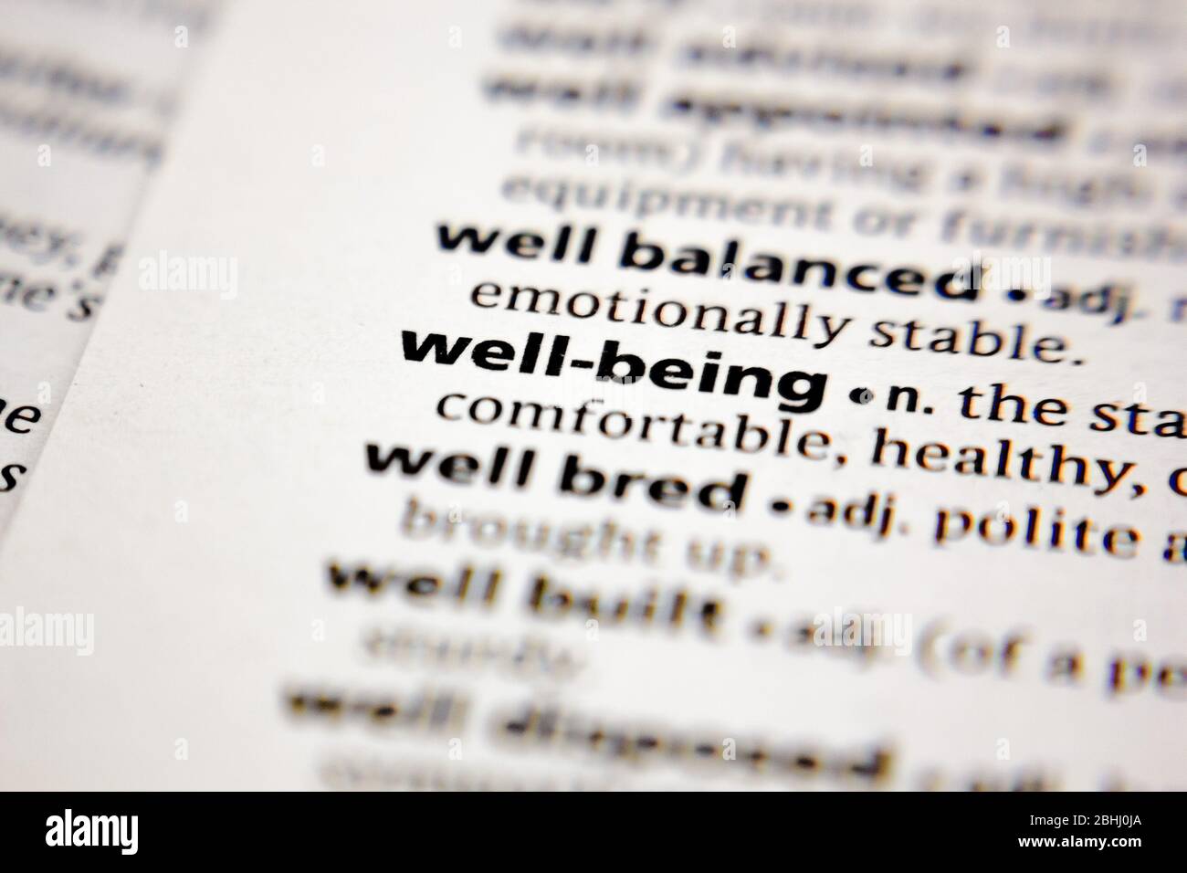 Word or phrase well-being in a dictionary Stock Photo - Alamy