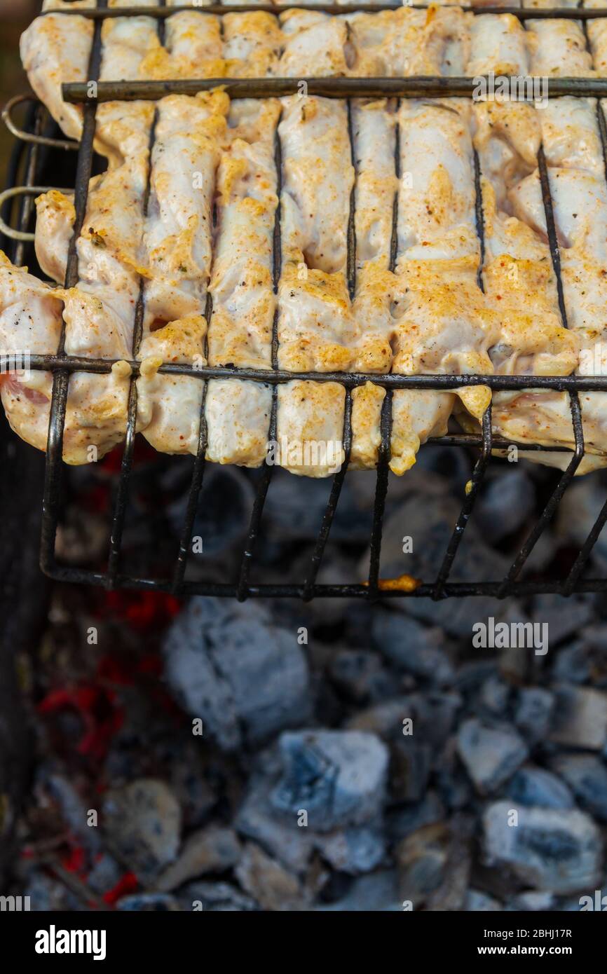 Chicken shish kebab on the grill is prepared on the grill Stock Photo ...