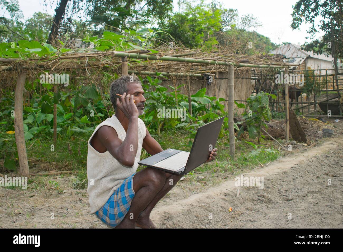 indian rural farmer using laptop and Mobile Phone Stock Photo - Alamy