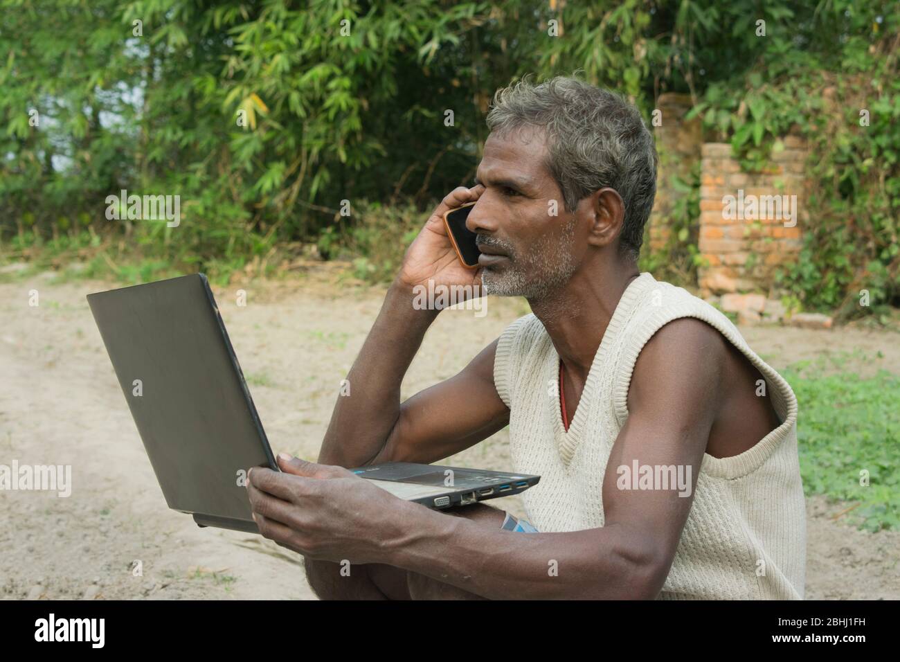 indian rural farmer using laptop and Mobile Phone Stock Photo - Alamy