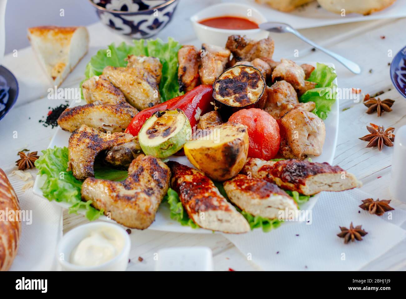 Meat plate - grilled kebabs from chiken meat, with grilled vegetables ...