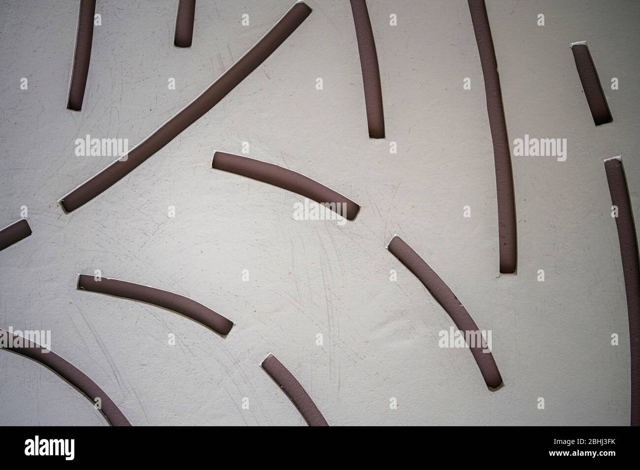 The building of minimal construction is a concrete white wall with ...