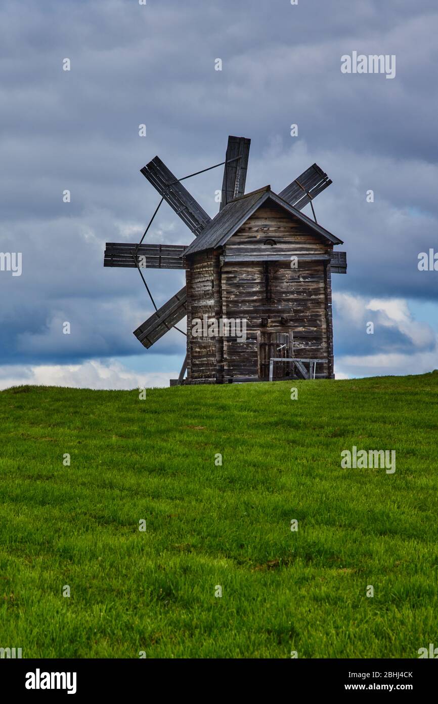 Vintage windmill wooden mill with wind wheel blades. Mill made from ...