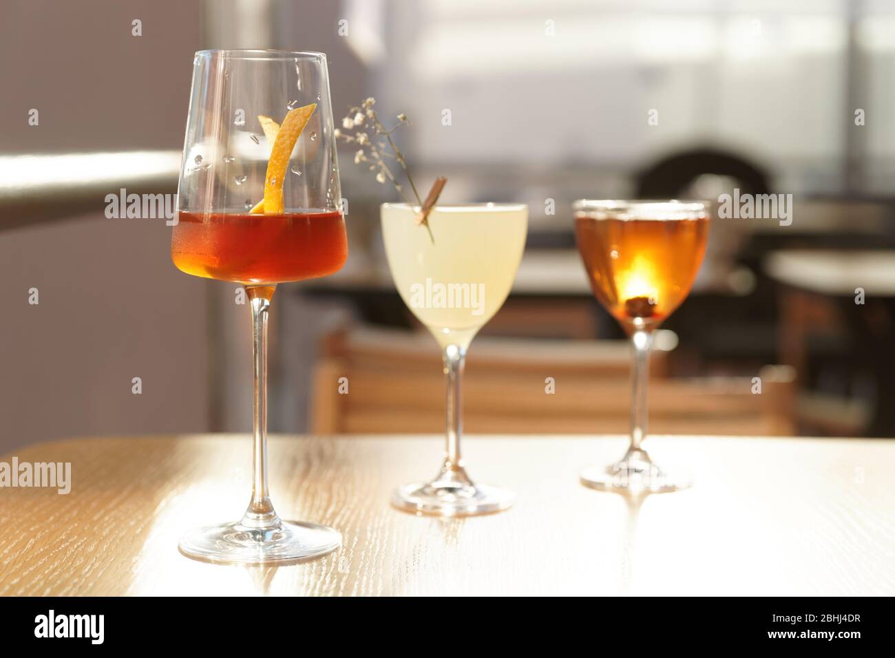 Three simple looking cocktails on restaurant table, sunlight Stock ...